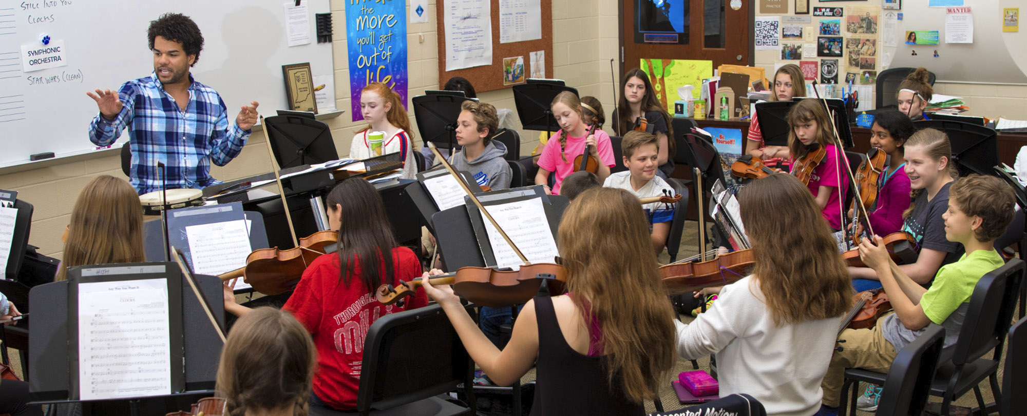 Ben Yoder, an alumnus who is in tune with his music students